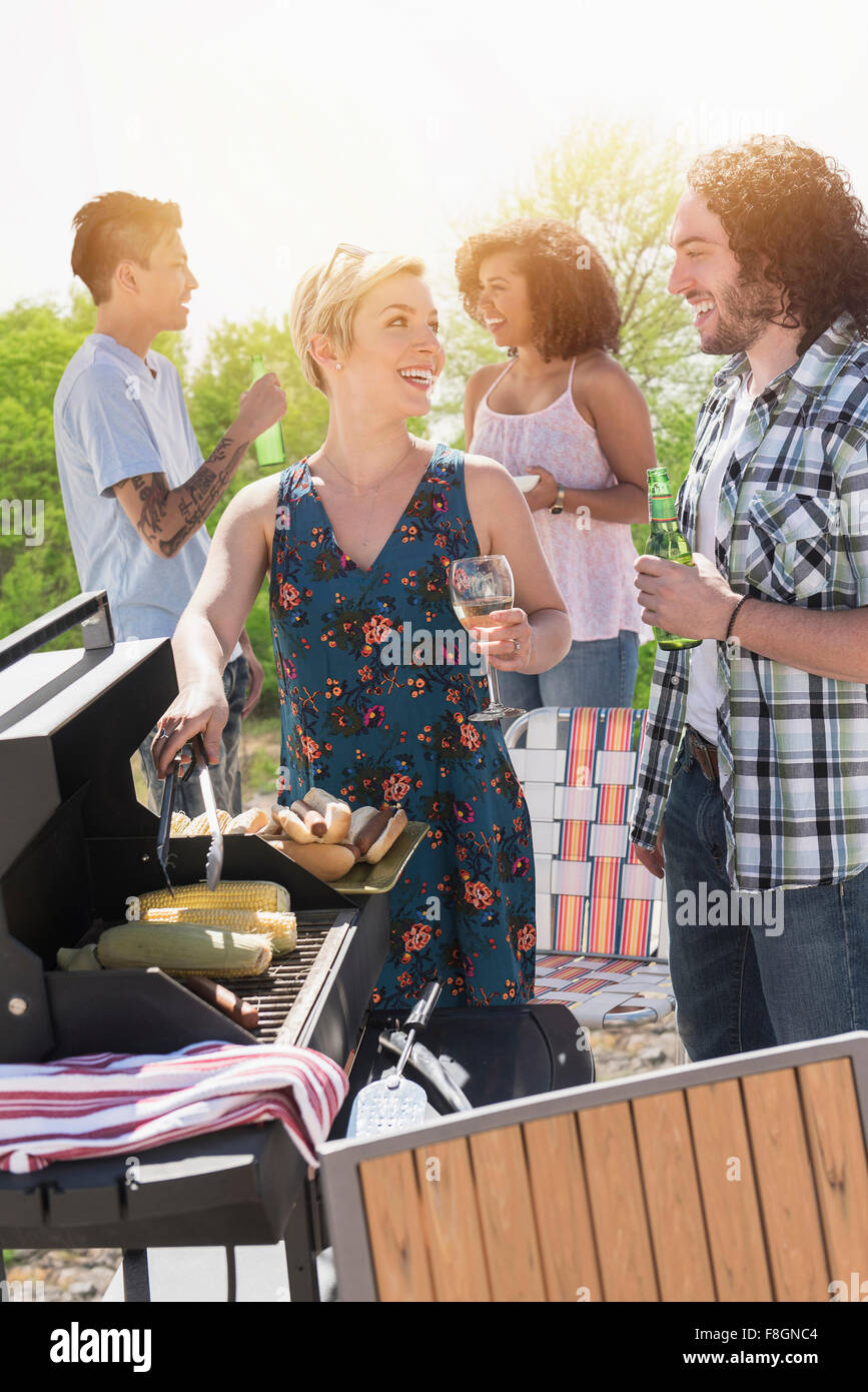 Woman serving hot dogs at barbecue Stock Photo - Alamy