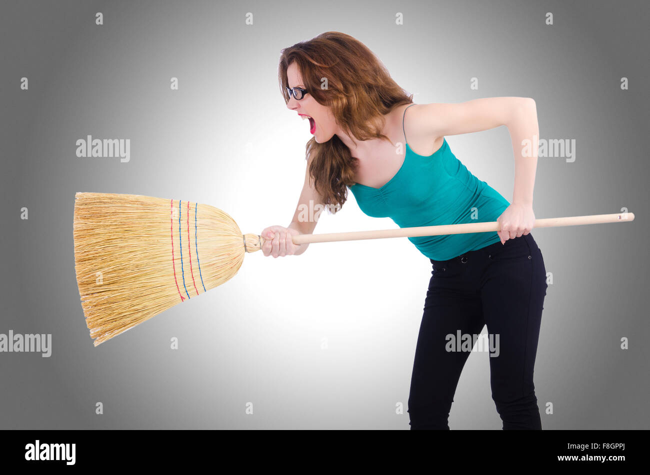 Young woman with broom on white Stock Photo - Alamy