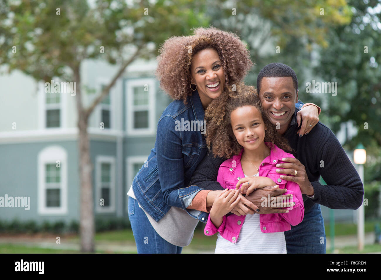 Family smiling outdoors Stock Photo - Alamy