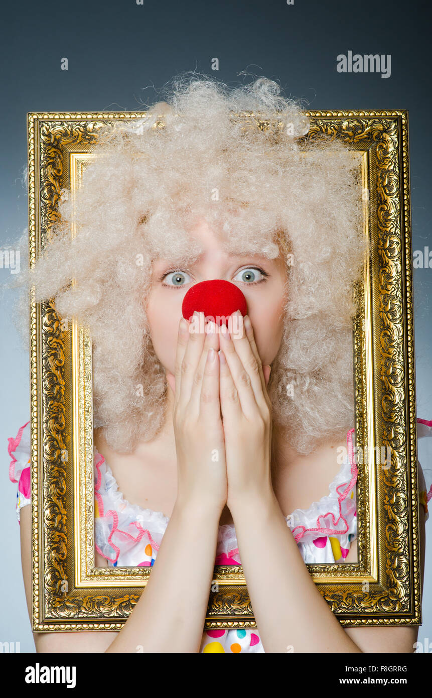 Funny clown with picture frame Stock Photo - Alamy