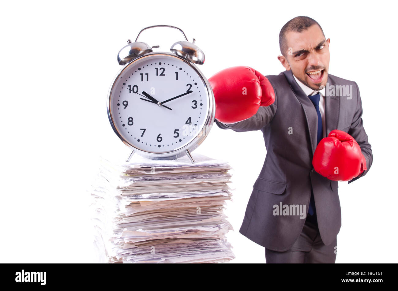 Angry businessman hitting clock isolated on white Stock Photo - Alamy