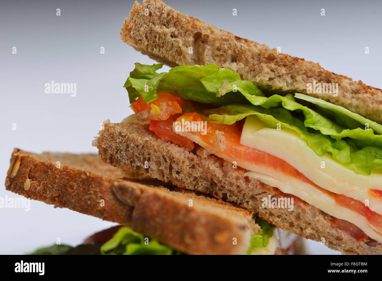 fresh sandwich close up with vegetables and meat fish isolated on white ...