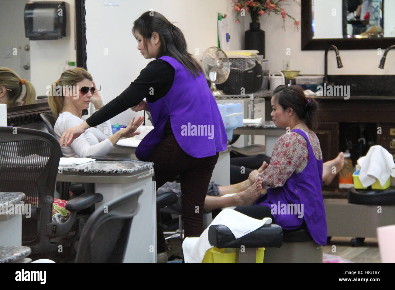 Lori Loughlin keeps her sunglasses on while she gets a manicure and ...