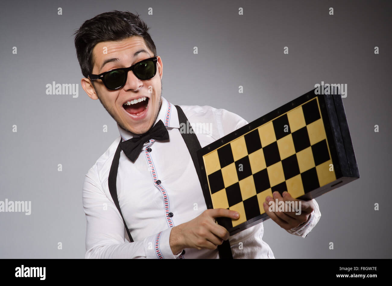 Funny chess player with board Stock Photo - Alamy