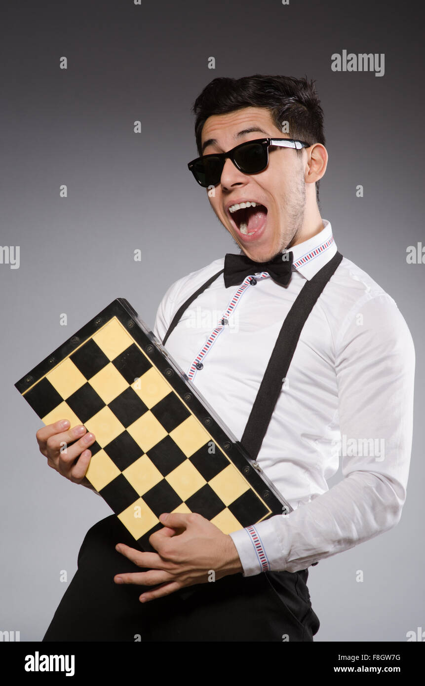 Funny chess player with board Stock Photo - Alamy