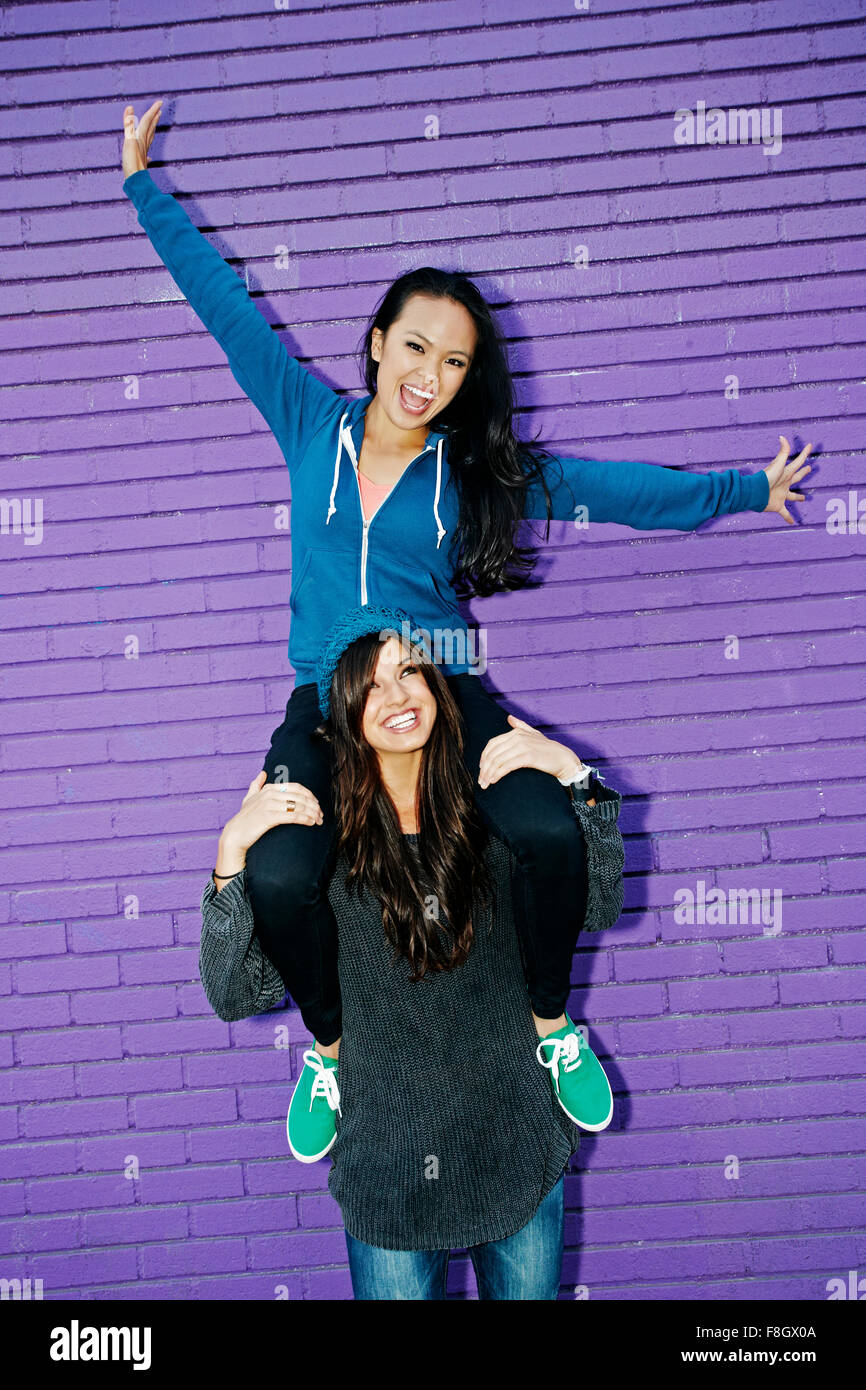 Woman carrying friend on shoulders Stock Photo - Alamy Woman carrying friend on shoulders Stock Photo - Alamy