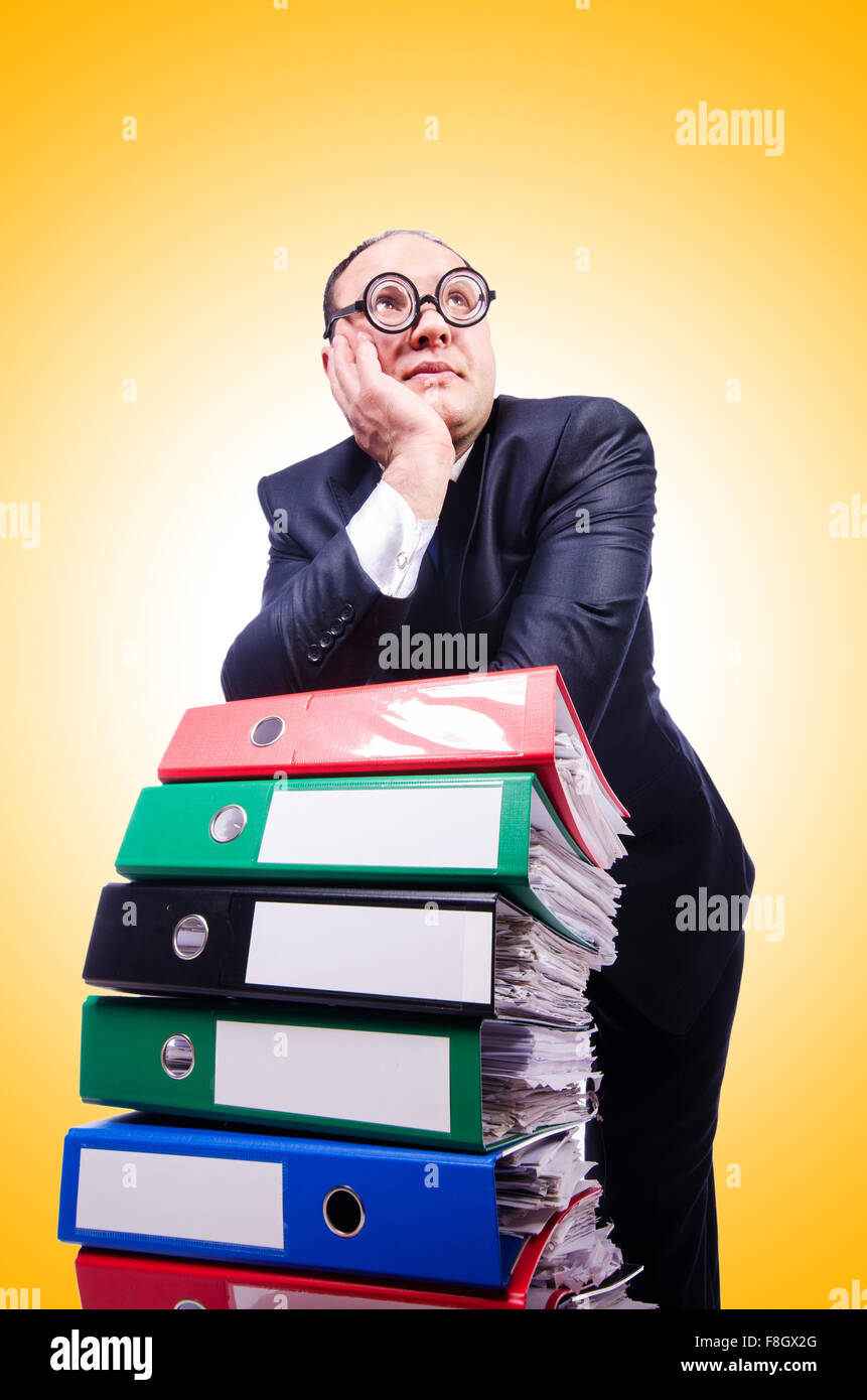 Funny man with lots of folders on white Stock Photo - Alamy