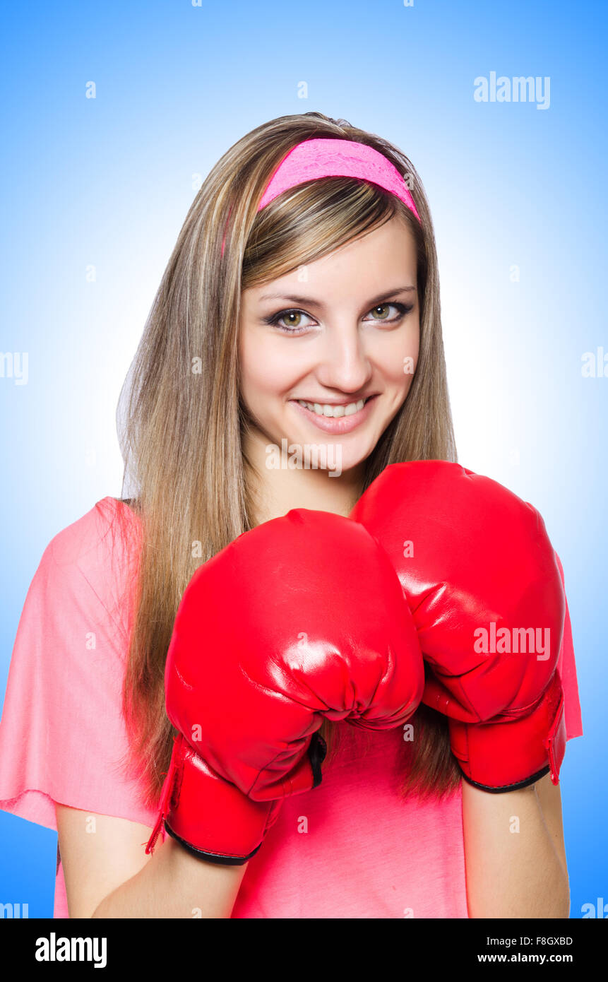 Young lady with boxing gloves on white Stock Photo - Alamy