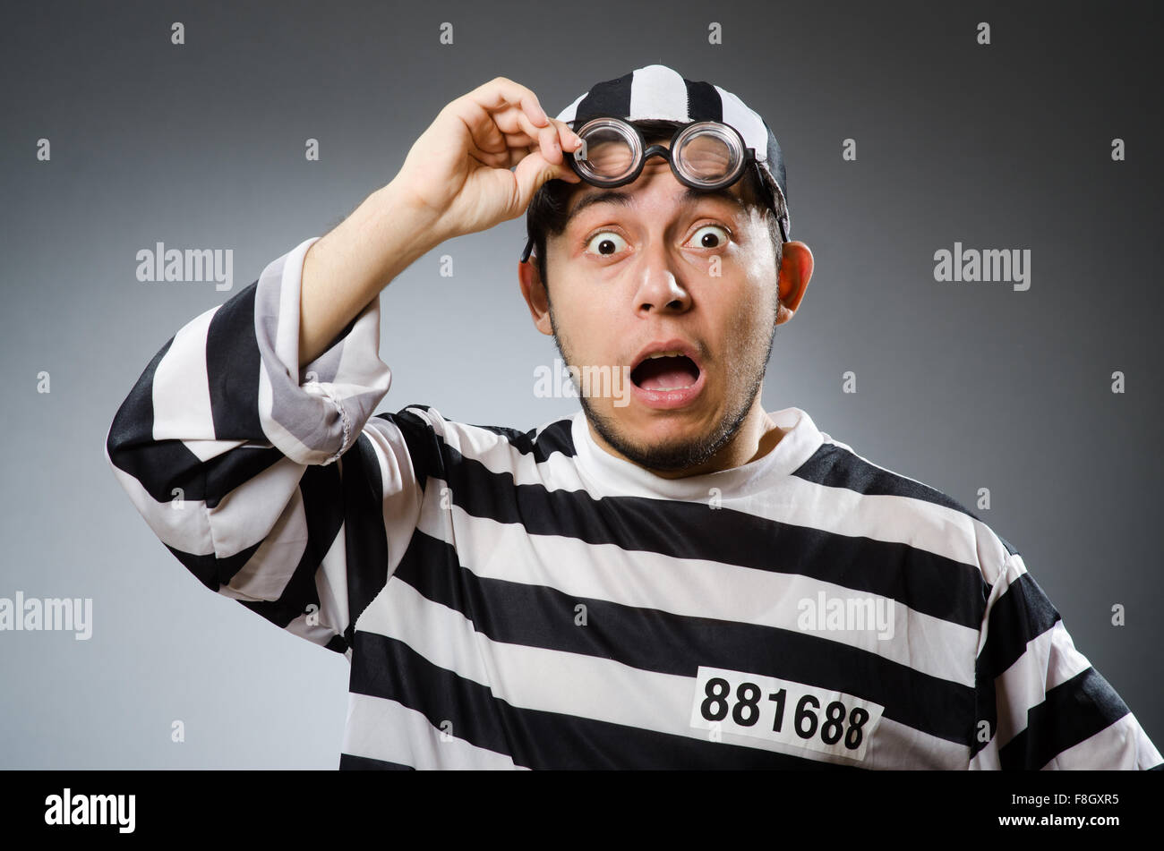Prison inmate in funny concept Stock Photo - Alamy