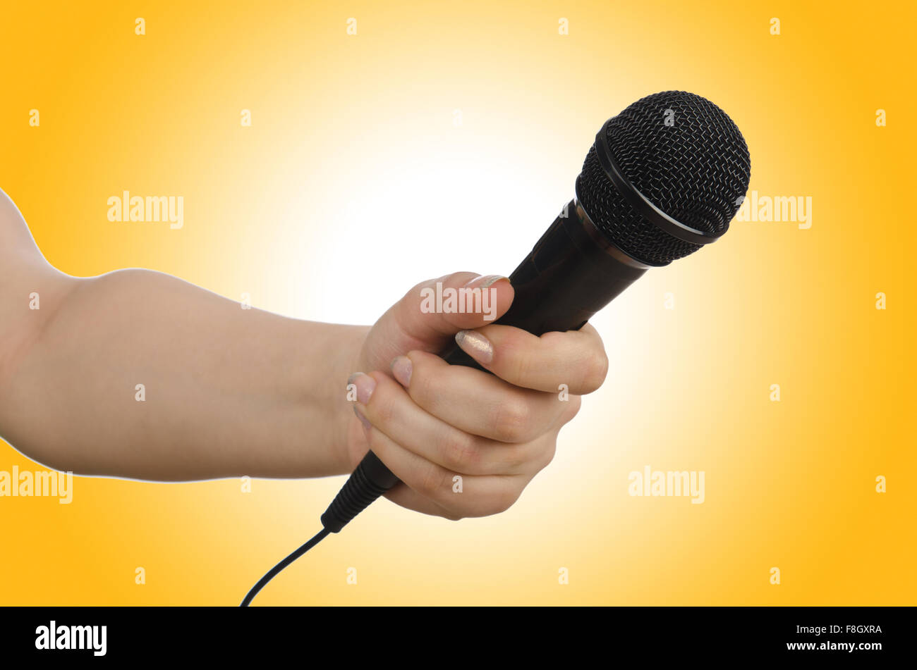 Hand with microphone on white Stock Photo - Alamy