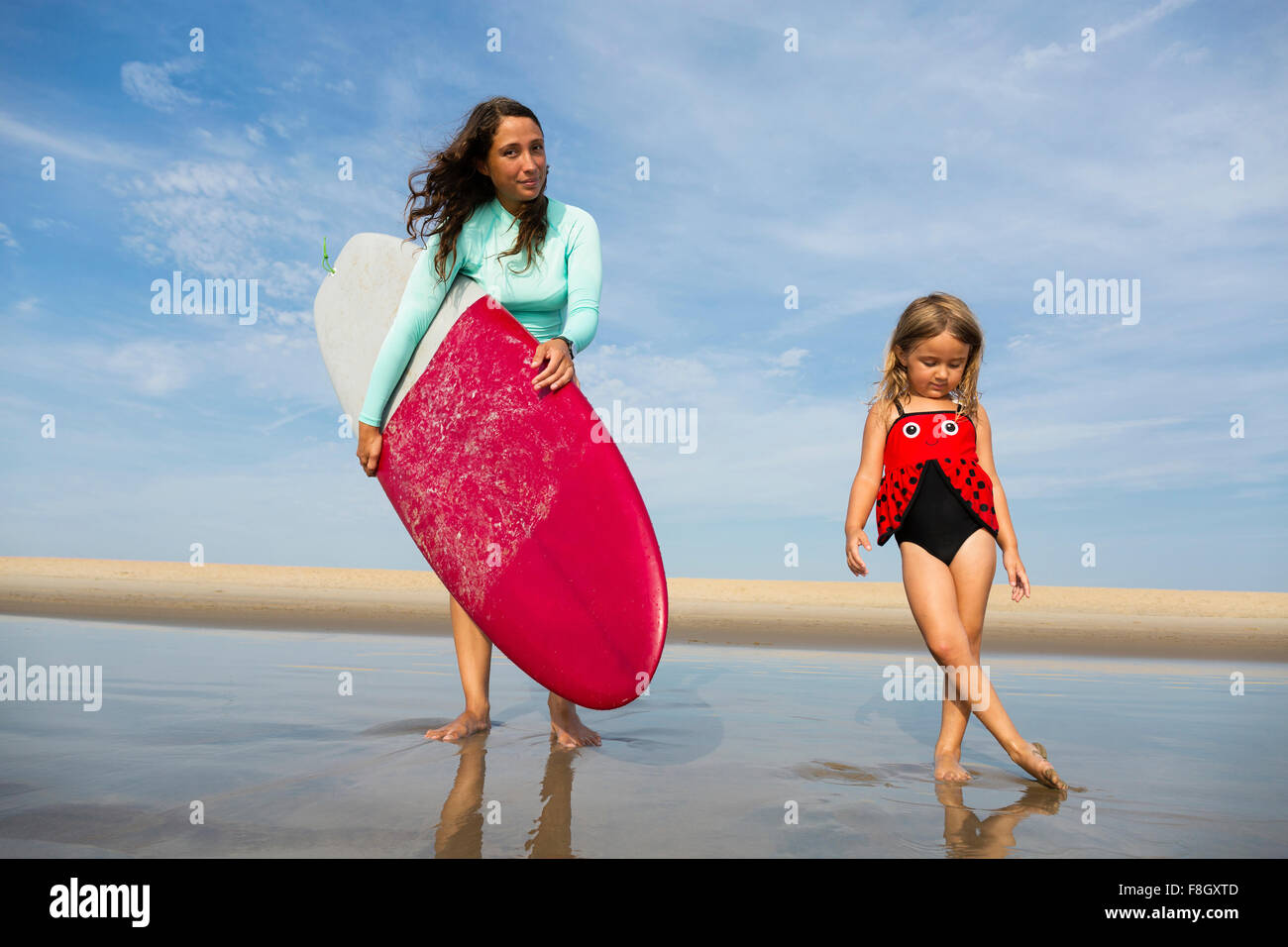 Mother and daughter playing in waves on beach Stock Photo - Alamy Mother and daughter playing in waves on beach Stock Photo - Alamy