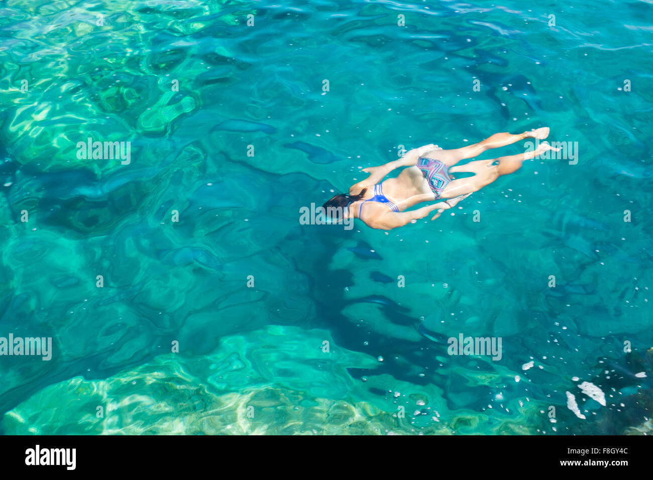Woman swimming underwater bikini hi-res stock photography and images ...