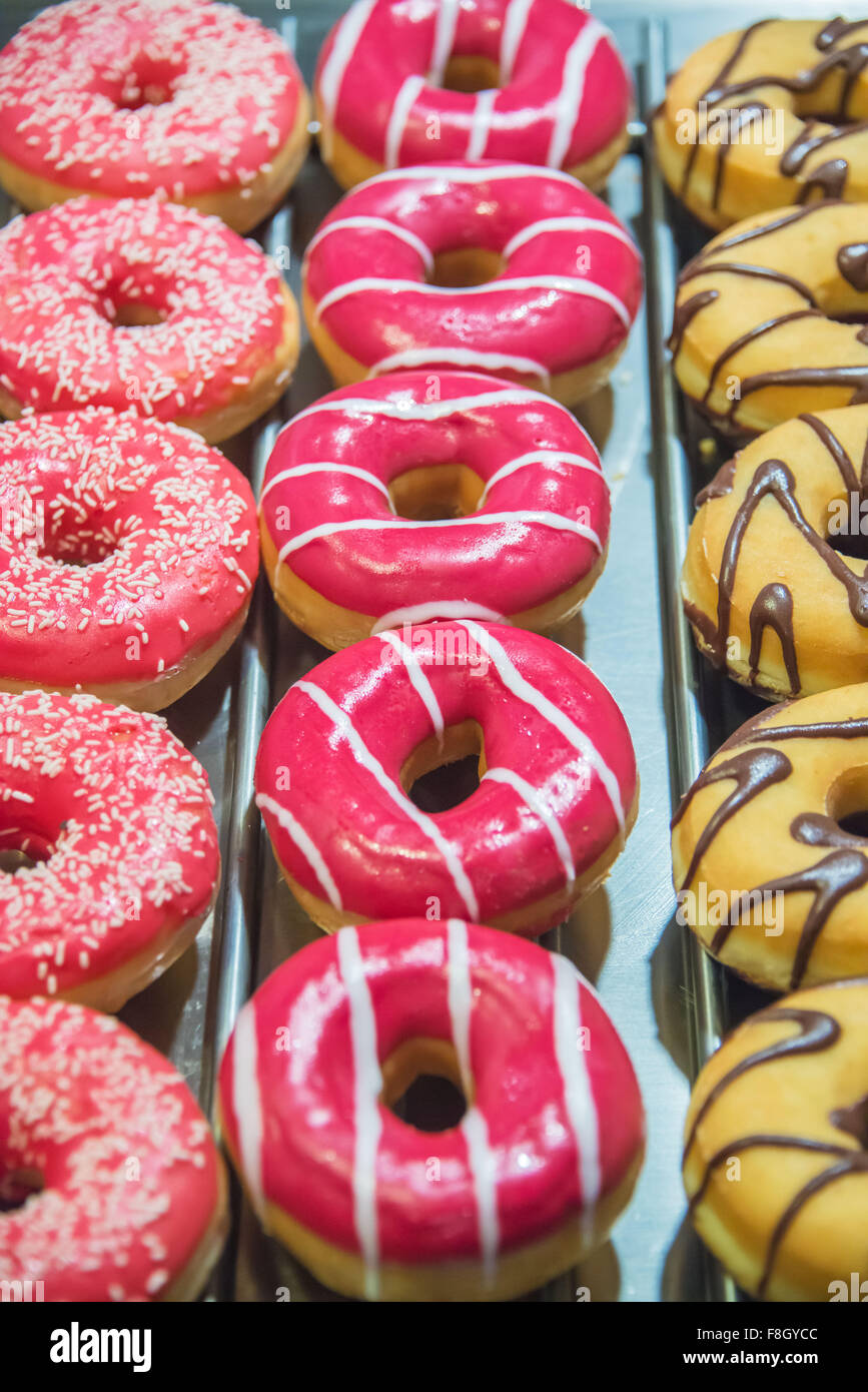 Sweet donuts arranged at display Stock Photo - Alamy