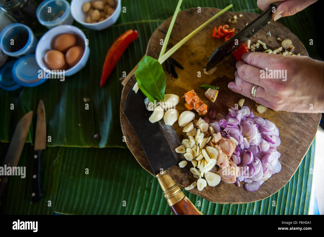Chef chopping ingredients on cutting board in kitchen Stock Photo - Alamy