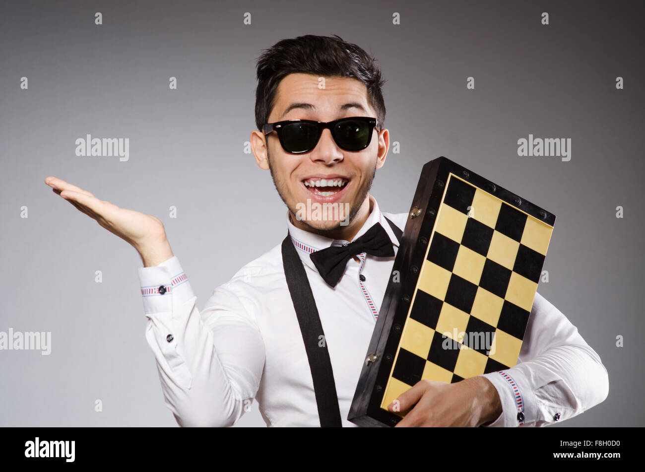 Funny chess player with board Stock Photo - Alamy