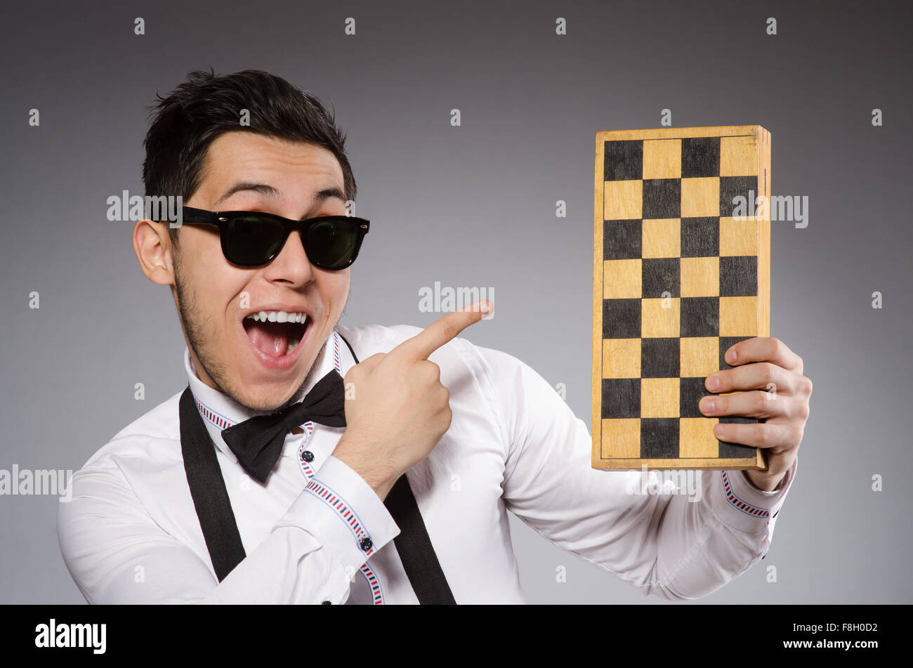 Funny chess player with board Stock Photo - Alamy