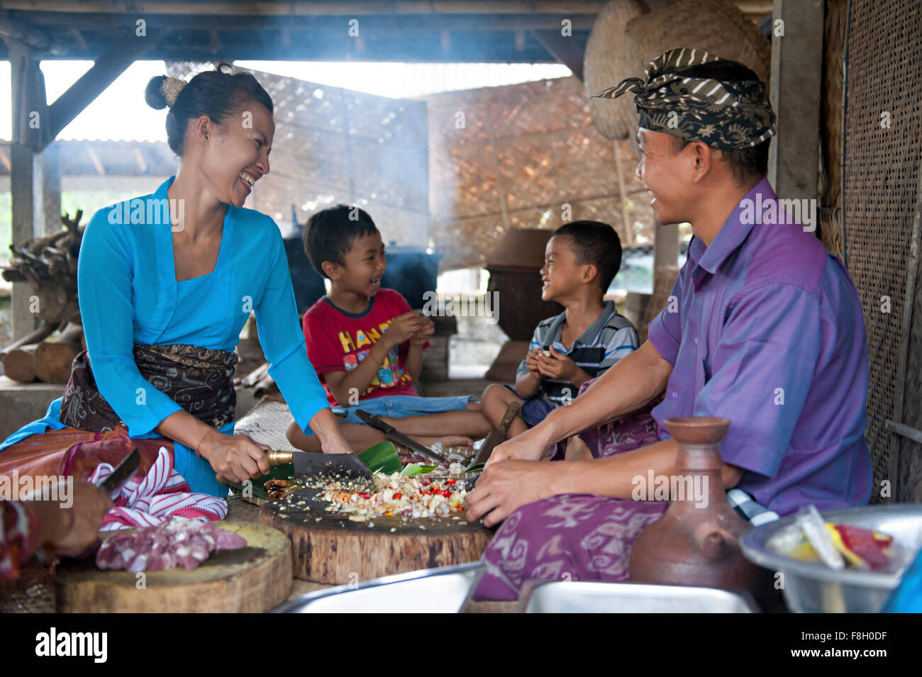 Asian family cooking together in outdoor kitchen Stock Photo - Alamy