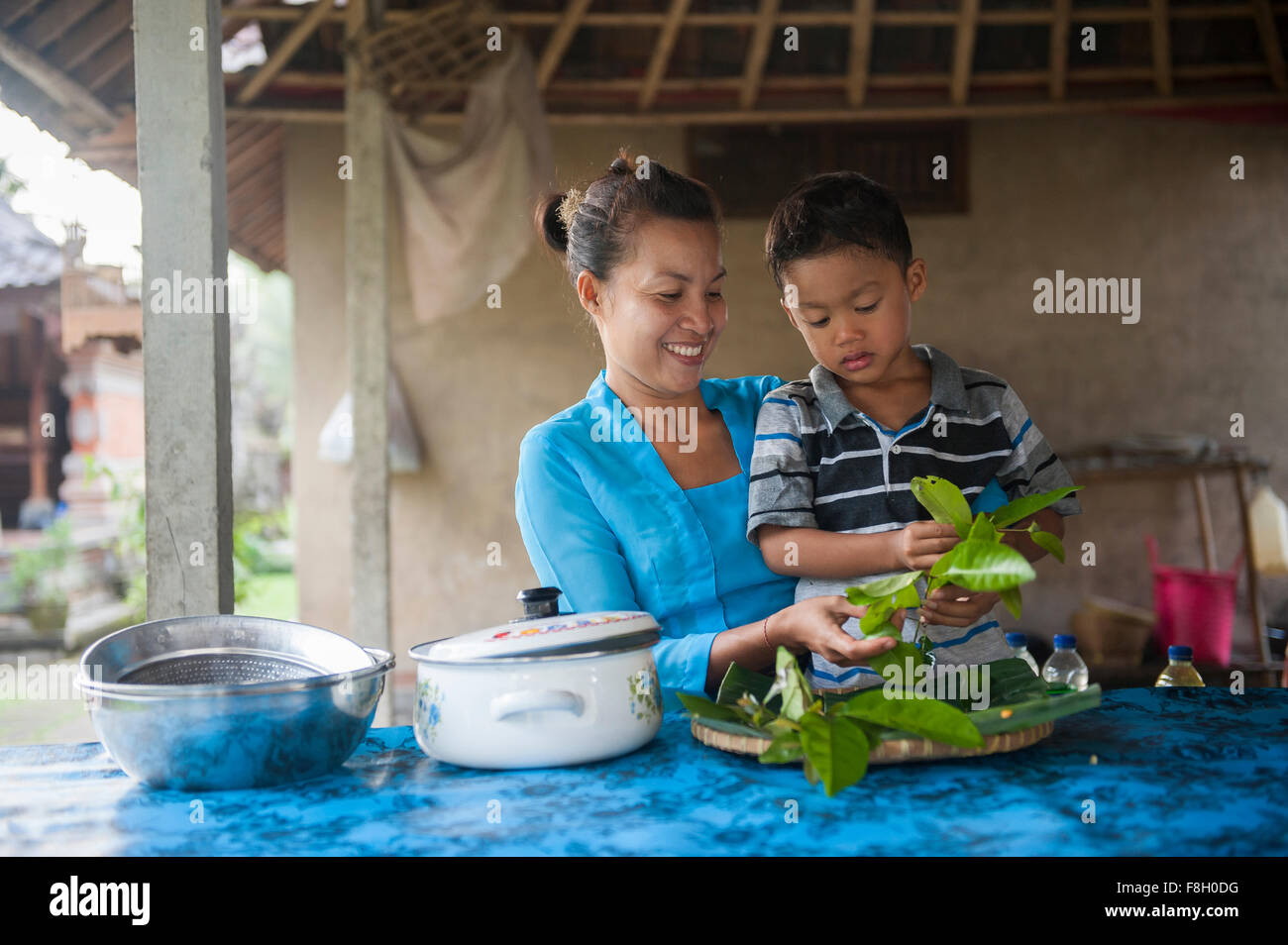 Son helping mom in kitchen hi-res stock photography and images - Alamy