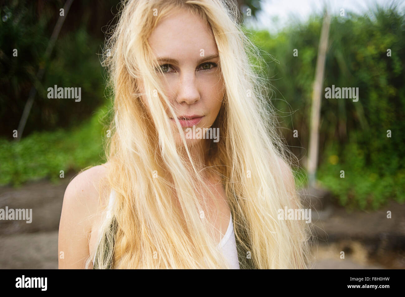 Woman standing on shoreline hi-res stock photography and images - Alamy