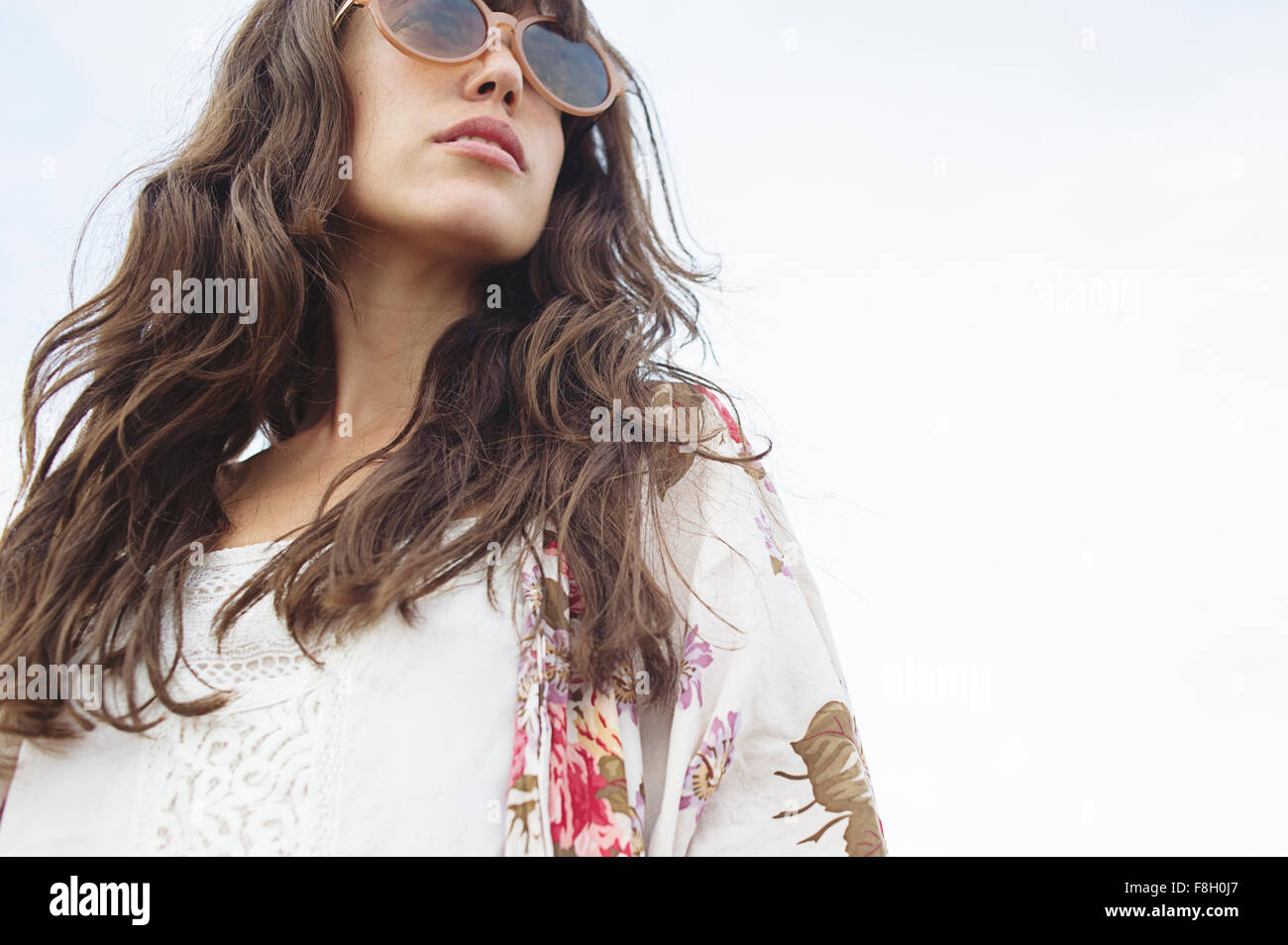 Low angle view of Caucasian woman wearing sunglasses outdoors Stock ...