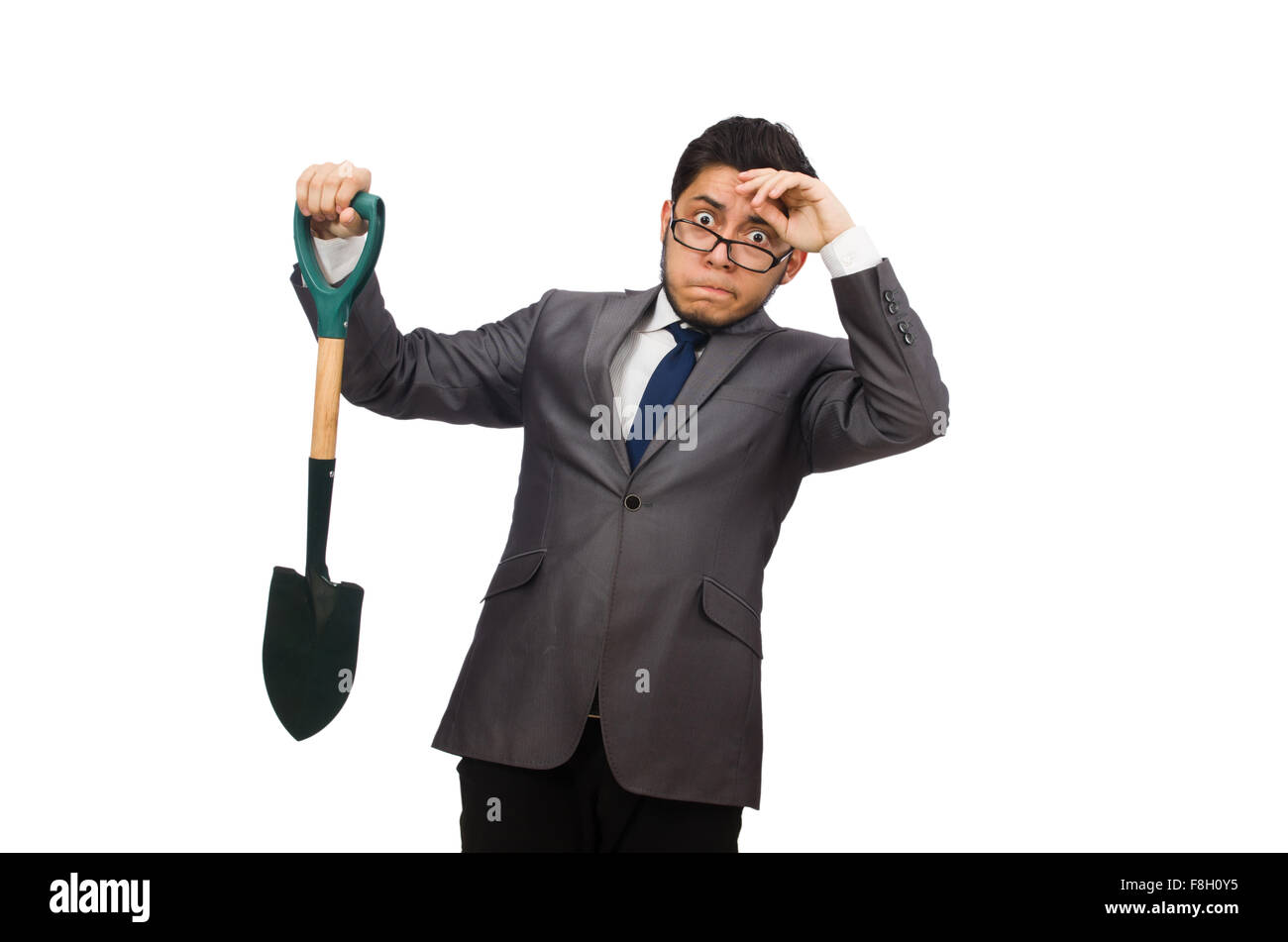 Young businessman holding a spade isolated on white Stock Photo - Alamy