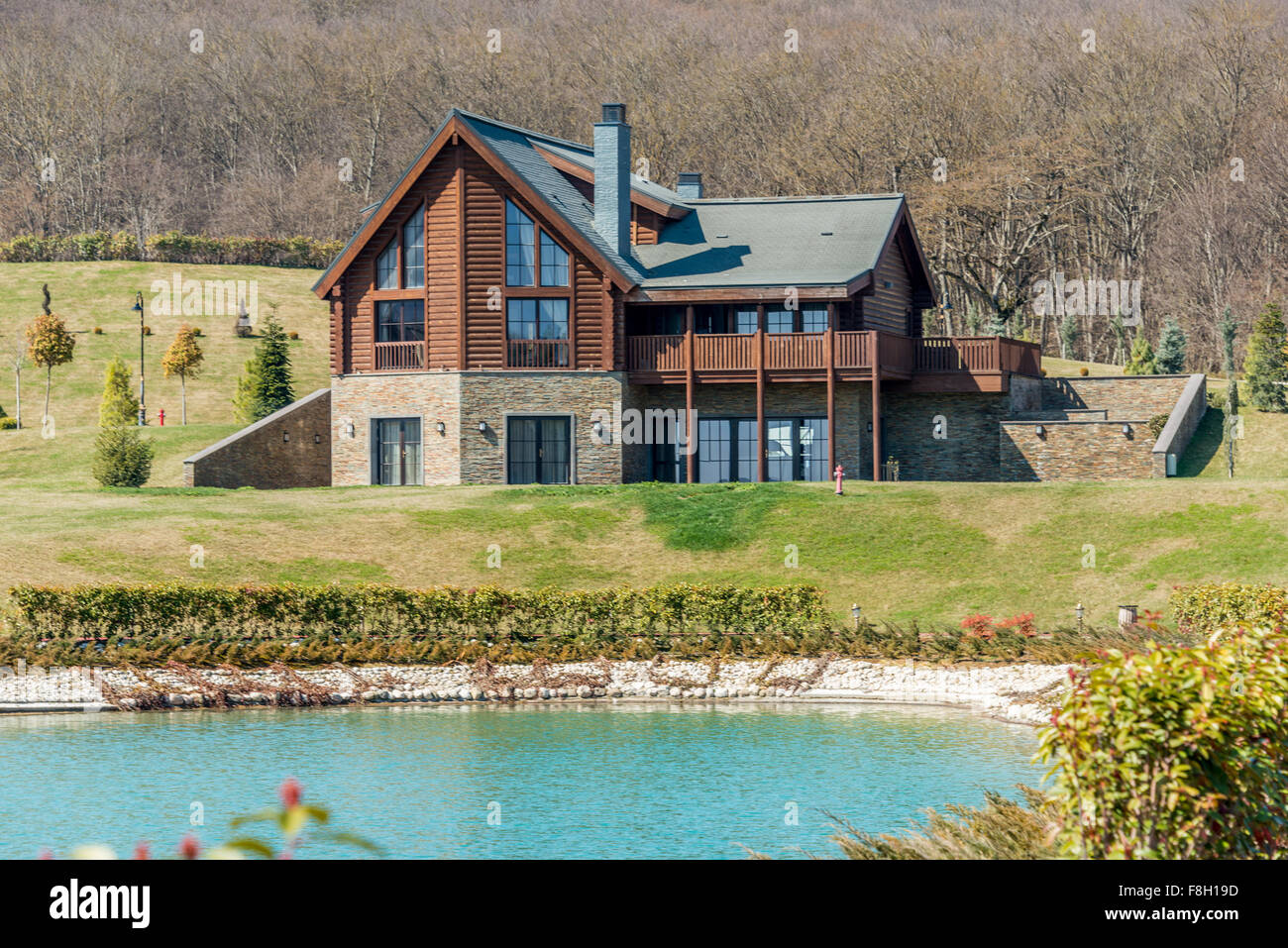 Modern house near water on bright day Stock Photo - Alamy