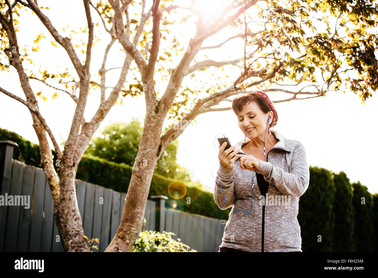 Caucasian woman using cell phone outdoors Stock Photo - Alamy
