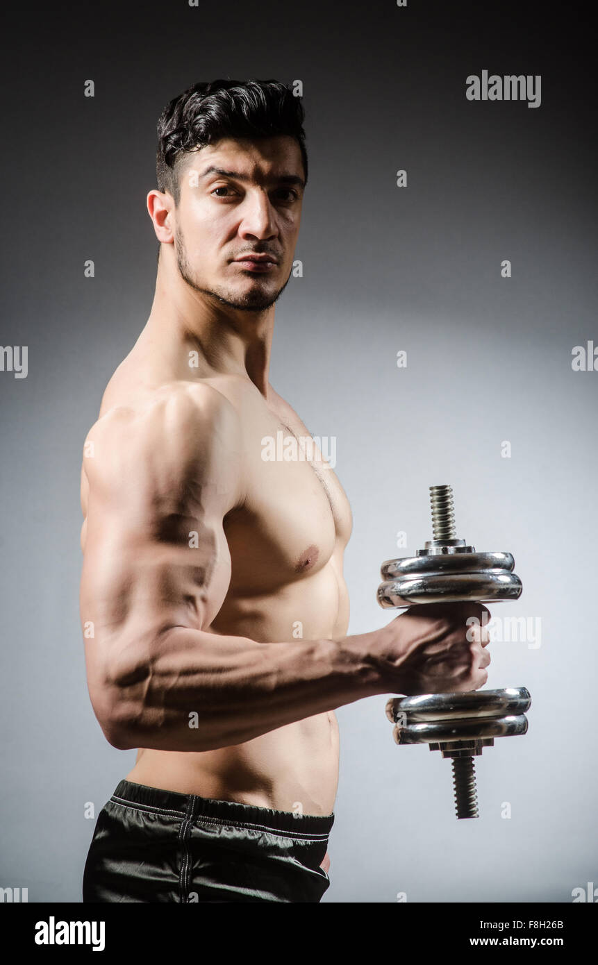 Muscular ripped bodybuilder with dumbbells Stock Photo - Alamy