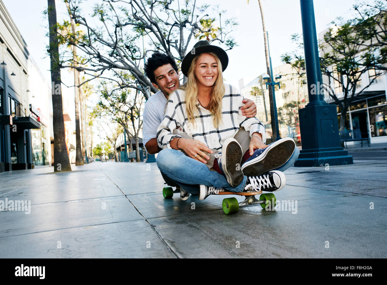 Active woman riding longboard hi-res stock photography and images - Alamy