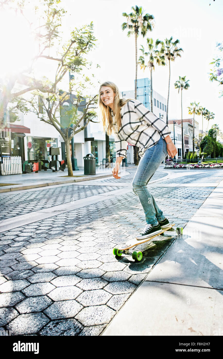 Active woman riding longboard hi-res stock photography and images - Alamy