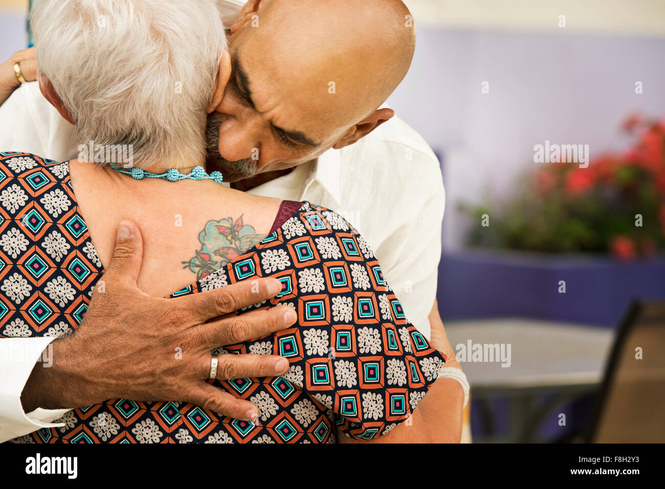 Two women hugging kissing hi-res stock photography and images - Alamy
