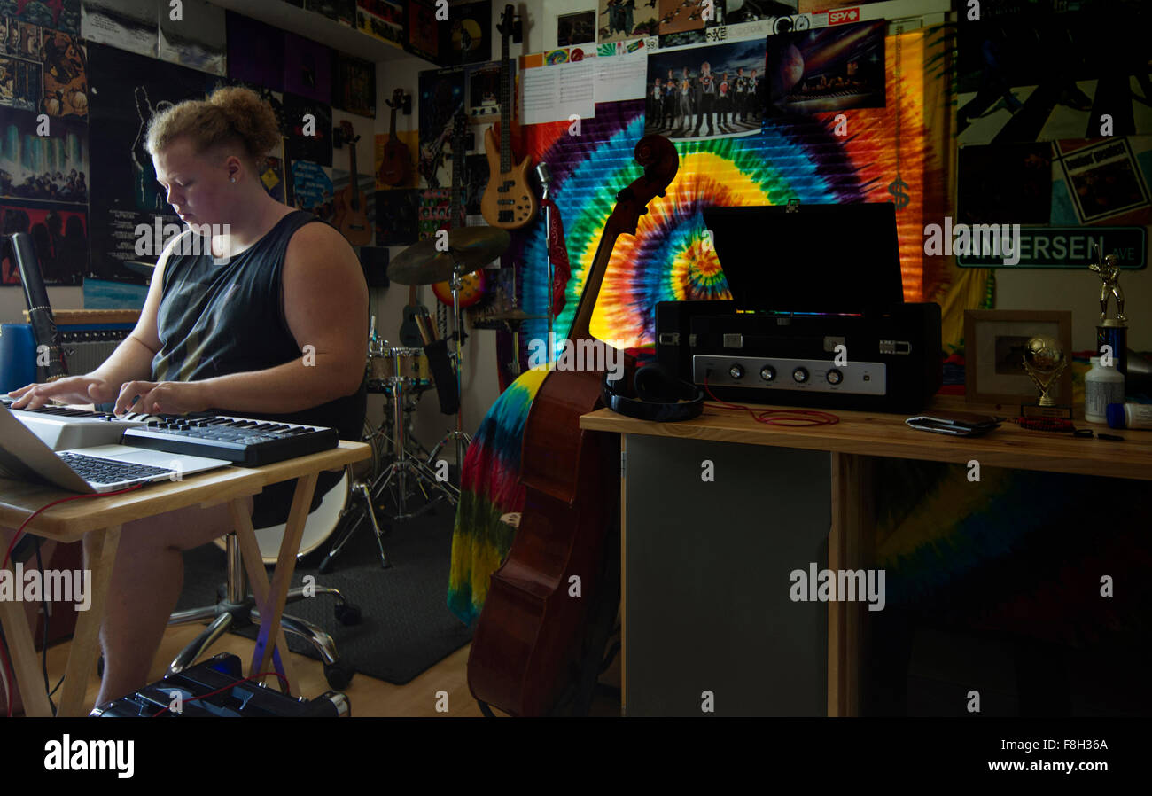 Caucasian man playing keyboard in music studio Stock Photo - Alamy