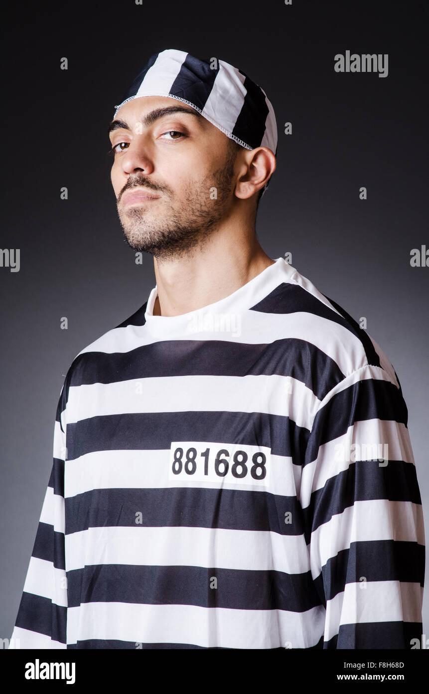Convict criminal in striped uniform Stock Photo - Alamy
