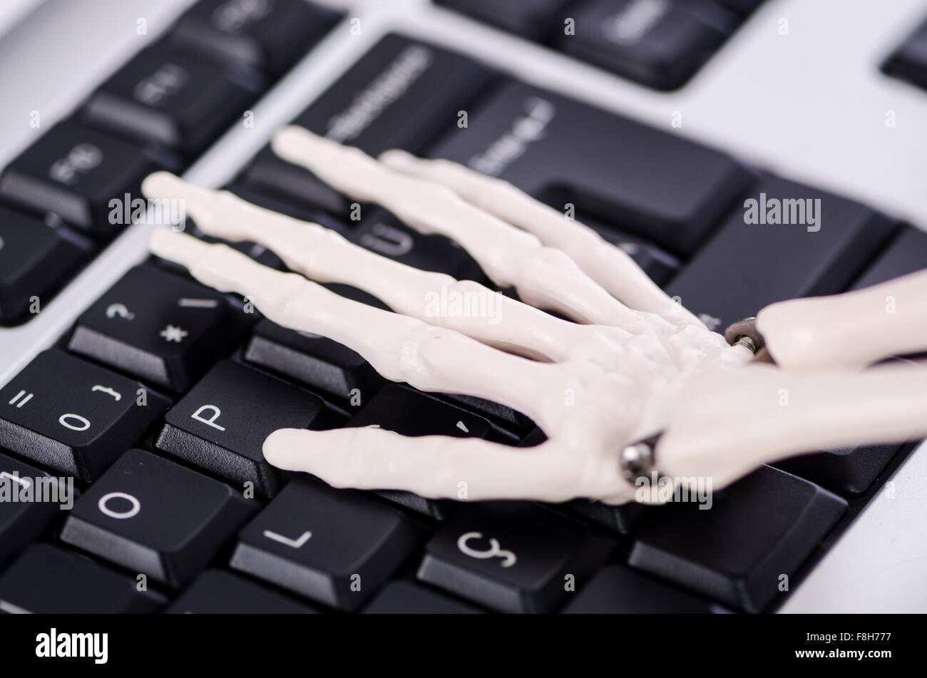 Skeleton working on the keyboard Stock Photo - Alamy