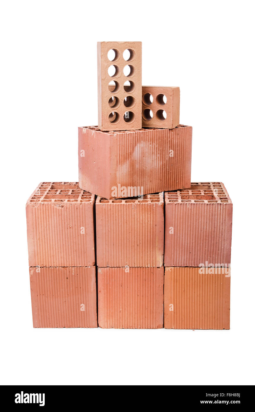 Stack of clay bricks isolated on white Stock Photo - Alamy