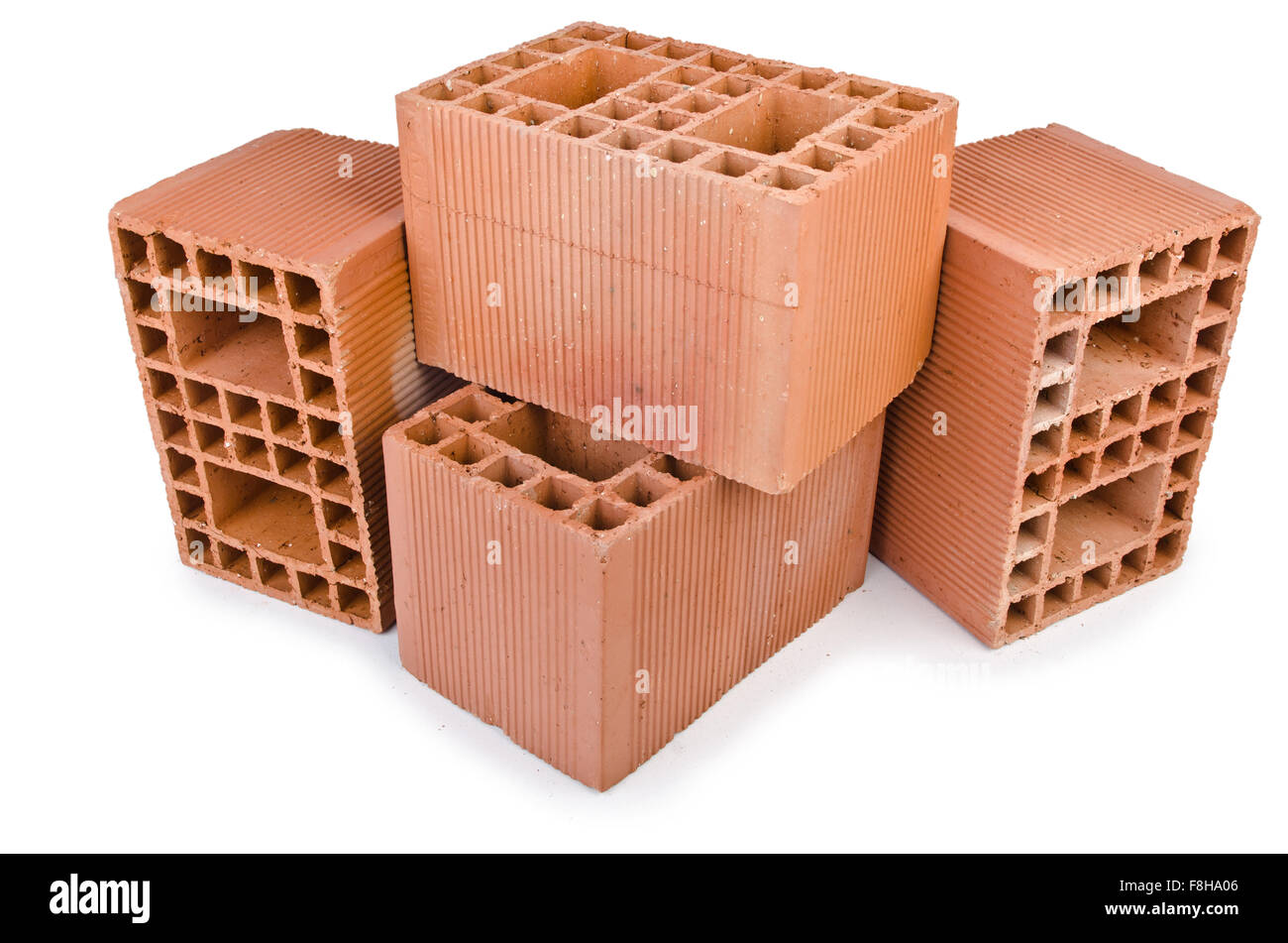 Stack of clay bricks isolated on white Stock Photo - Alamy