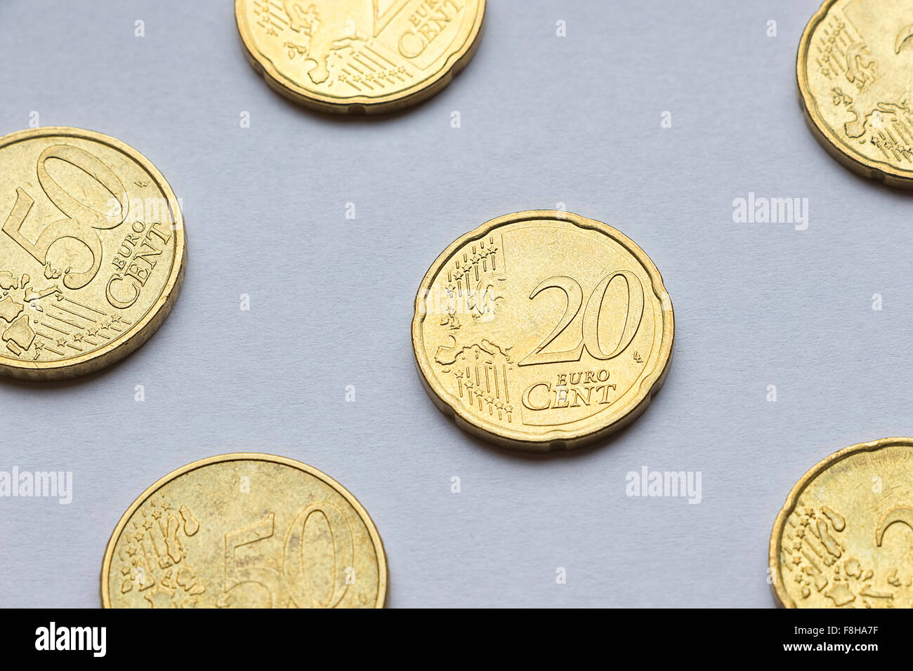 Small Euro coins on white paper background Stock Photo - Alamy