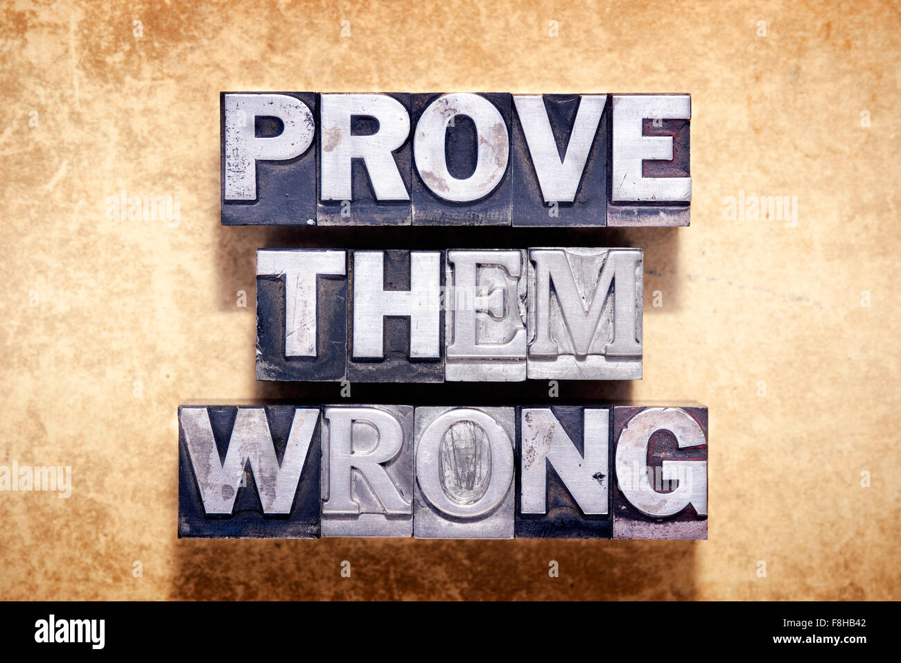 prove them wrong phrase made from metallic letterpress type on grunge ...