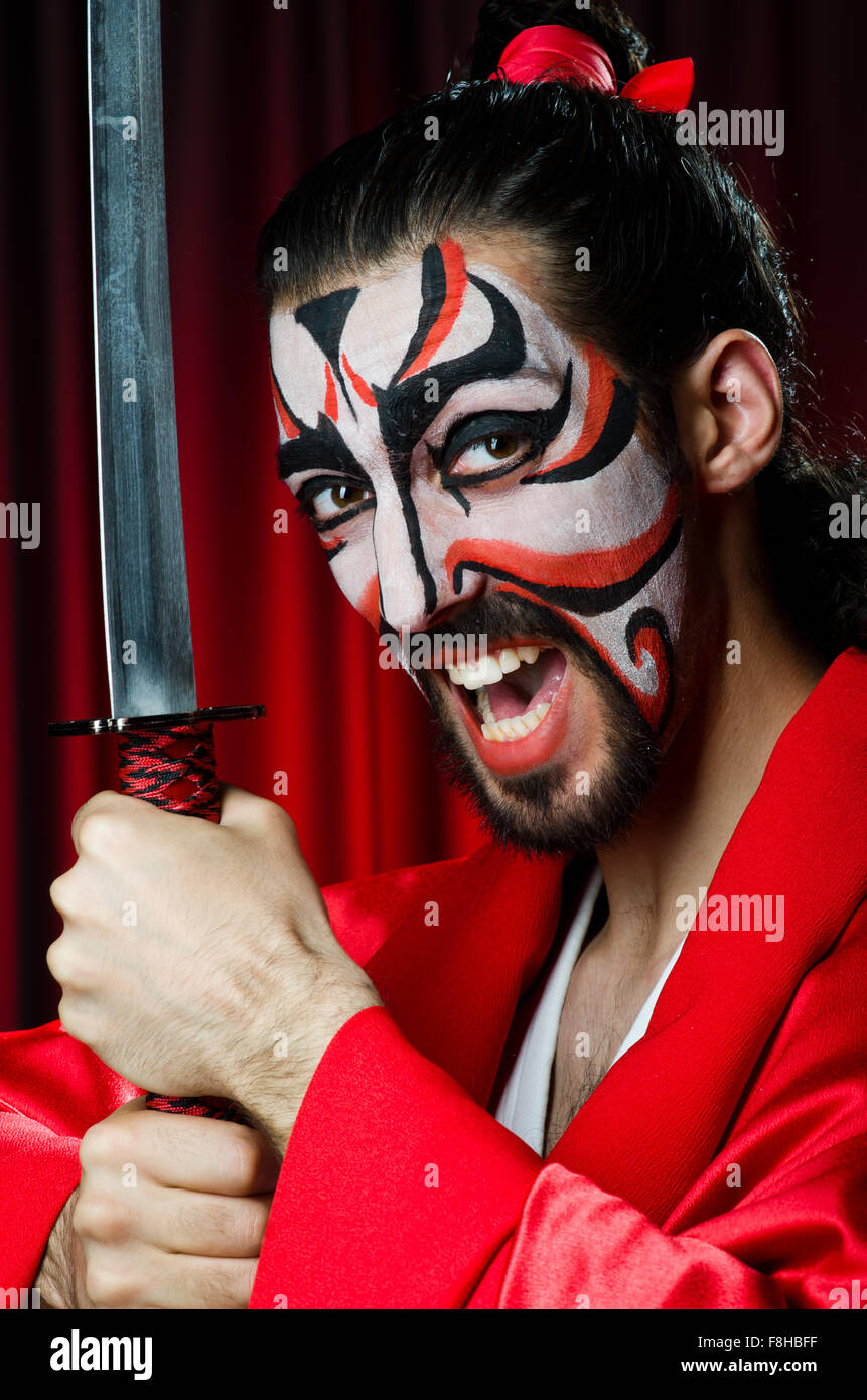 Man with sword and face mask Stock Photo - Alamy
