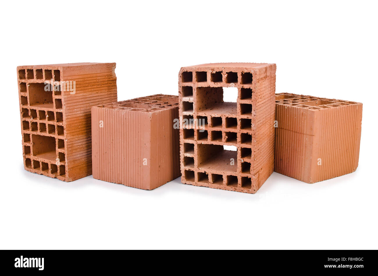 Stack of clay bricks isolated on white Stock Photo - Alamy