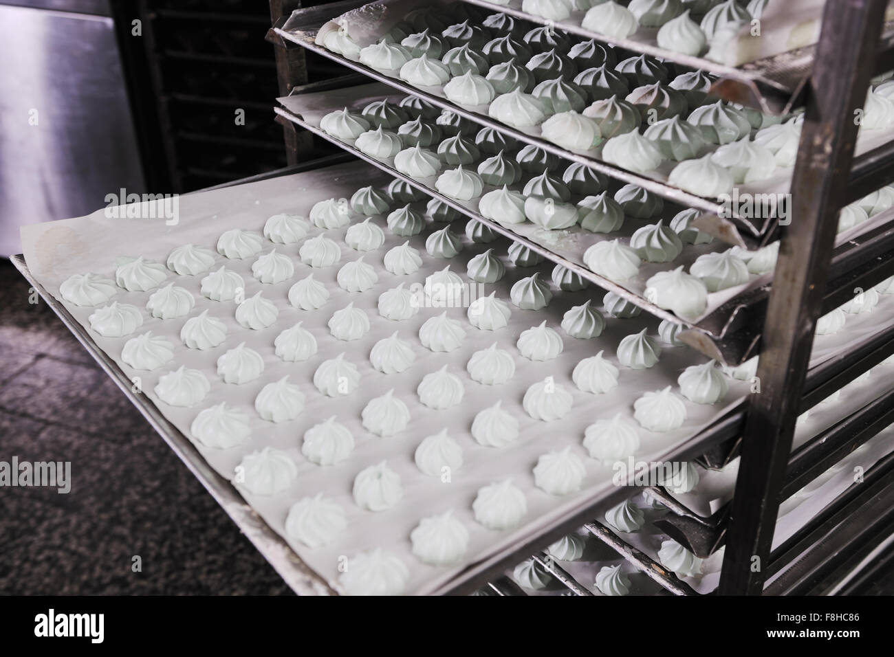 many sweet cake food factory massive production Stock Photo - Alamy