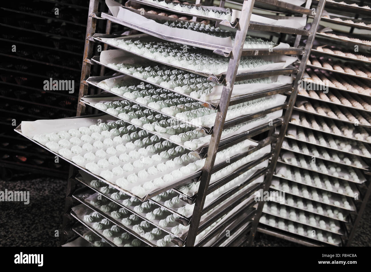 many sweet cake food factory massive production Stock Photo - Alamy