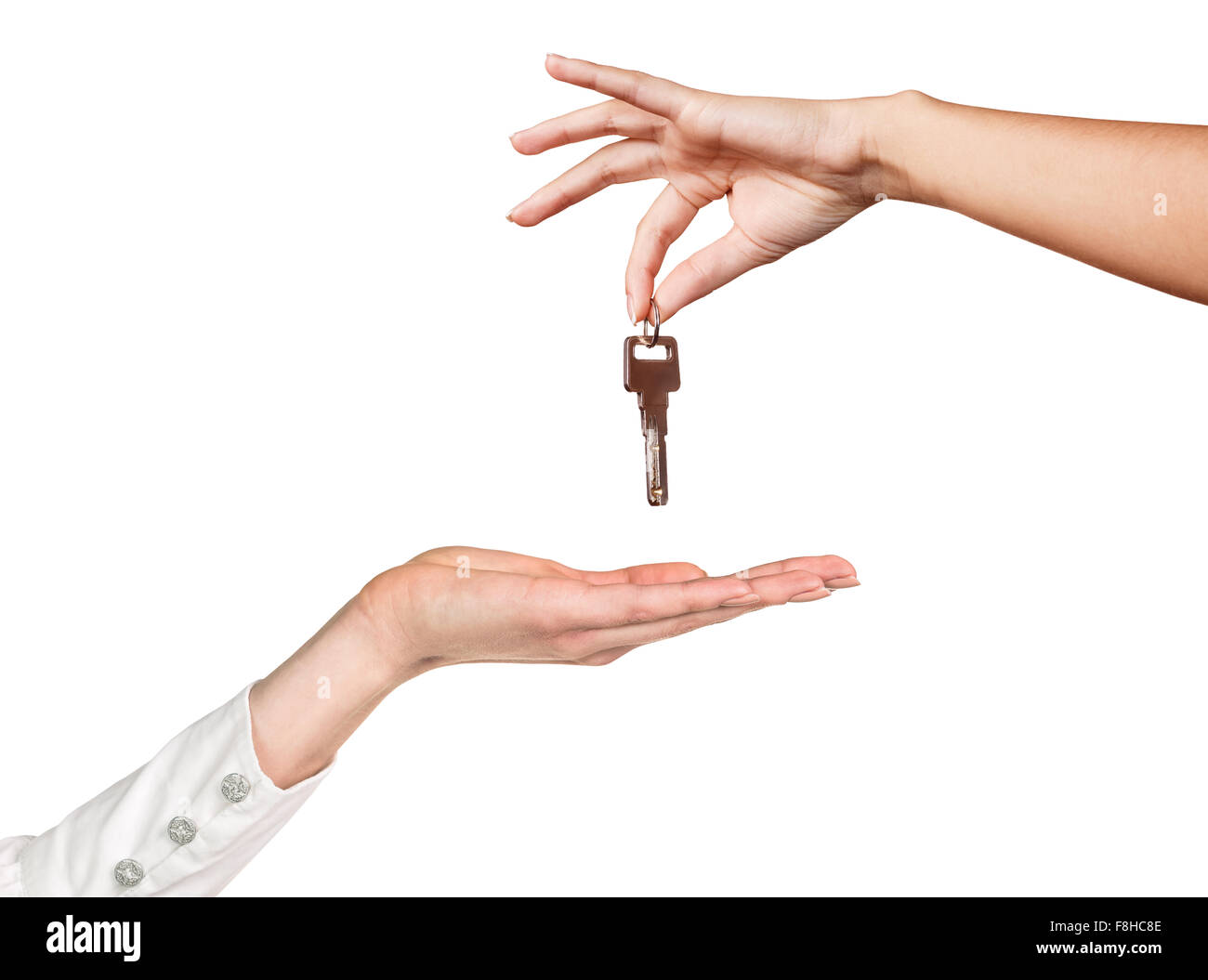 Hand giving a key Stock Photo - Alamy