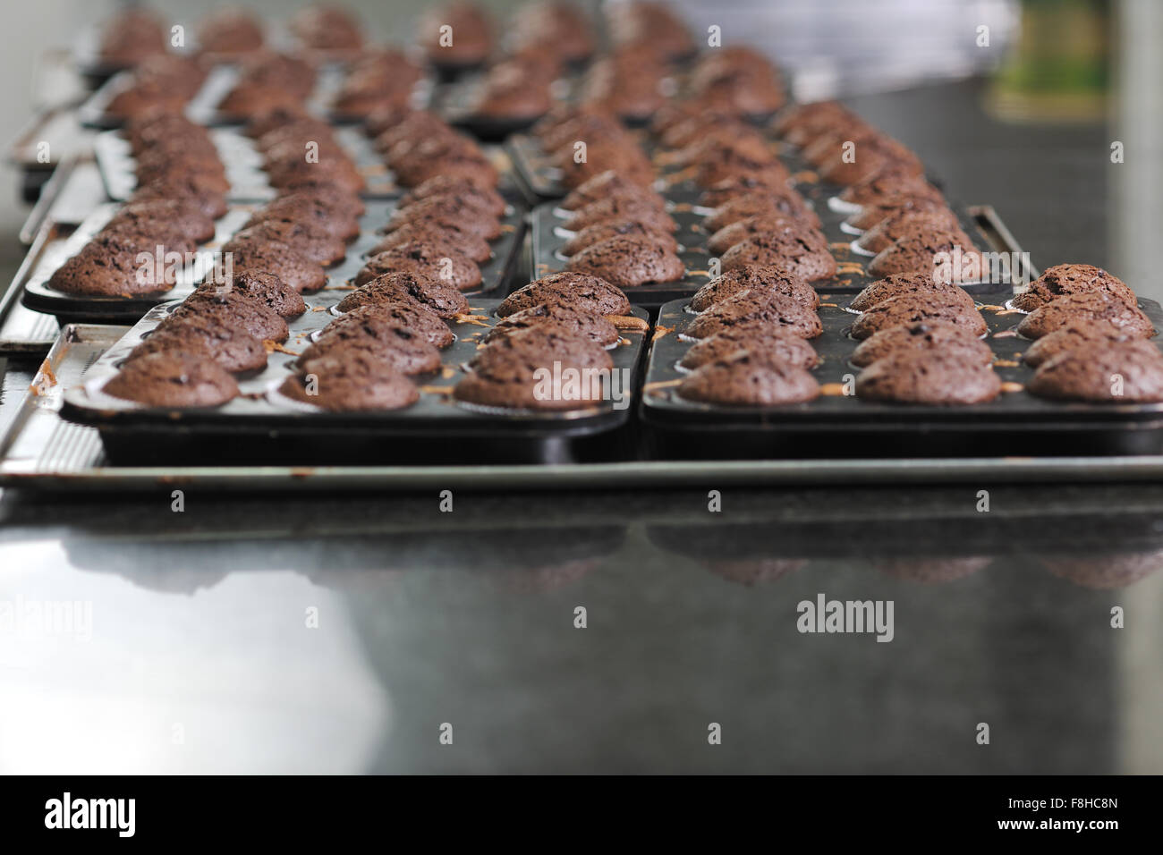 many sweet cake food factory massive production Stock Photo - Alamy