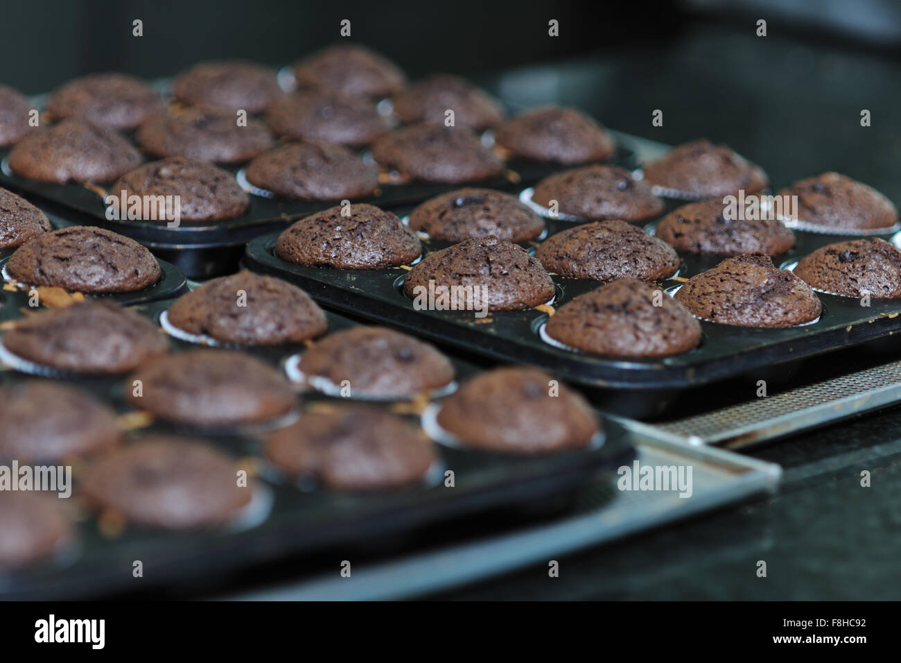 many sweet cake food factory massive production Stock Photo - Alamy