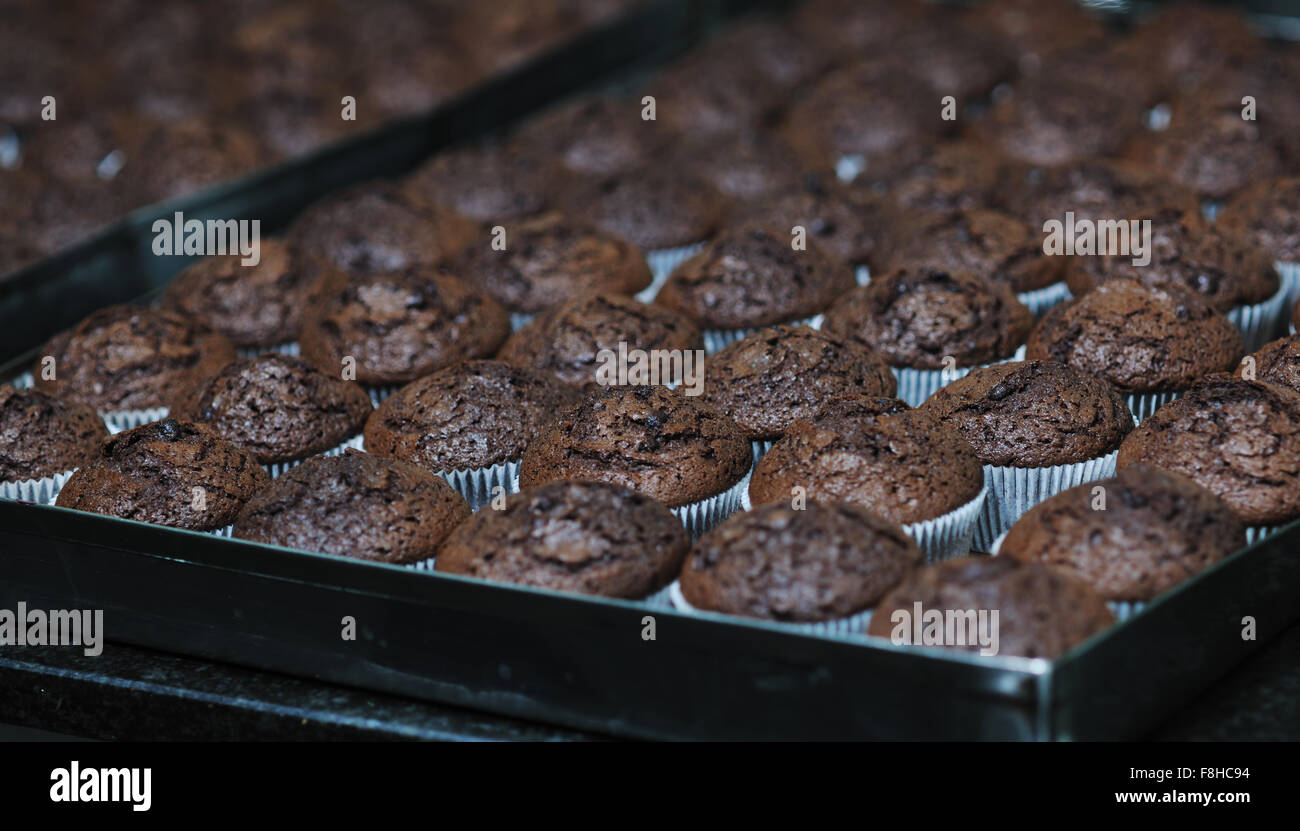 many sweet cake food factory massive production Stock Photo - Alamy