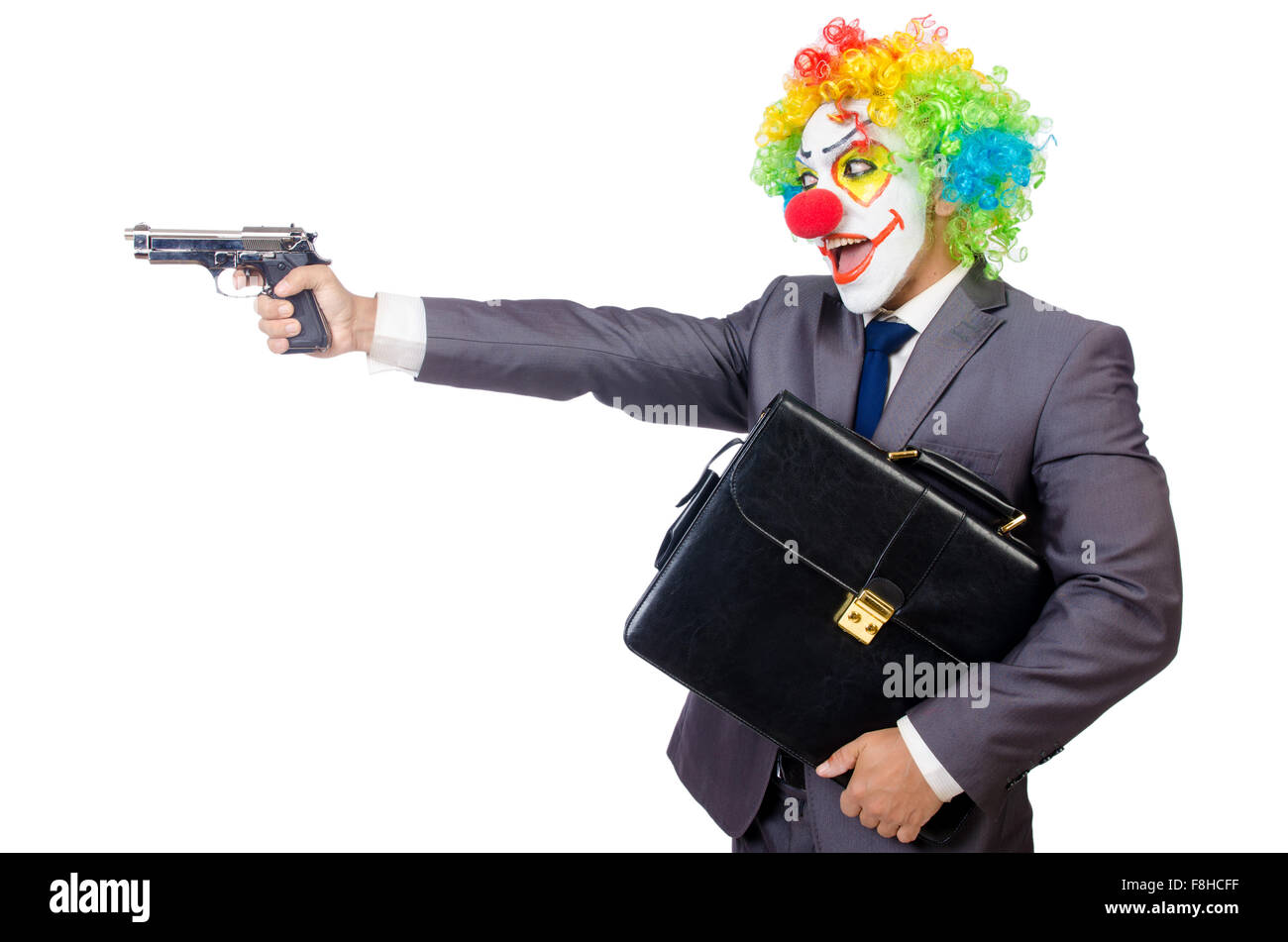 Businessman clown with gun isolated on white Stock Photo - Alamy