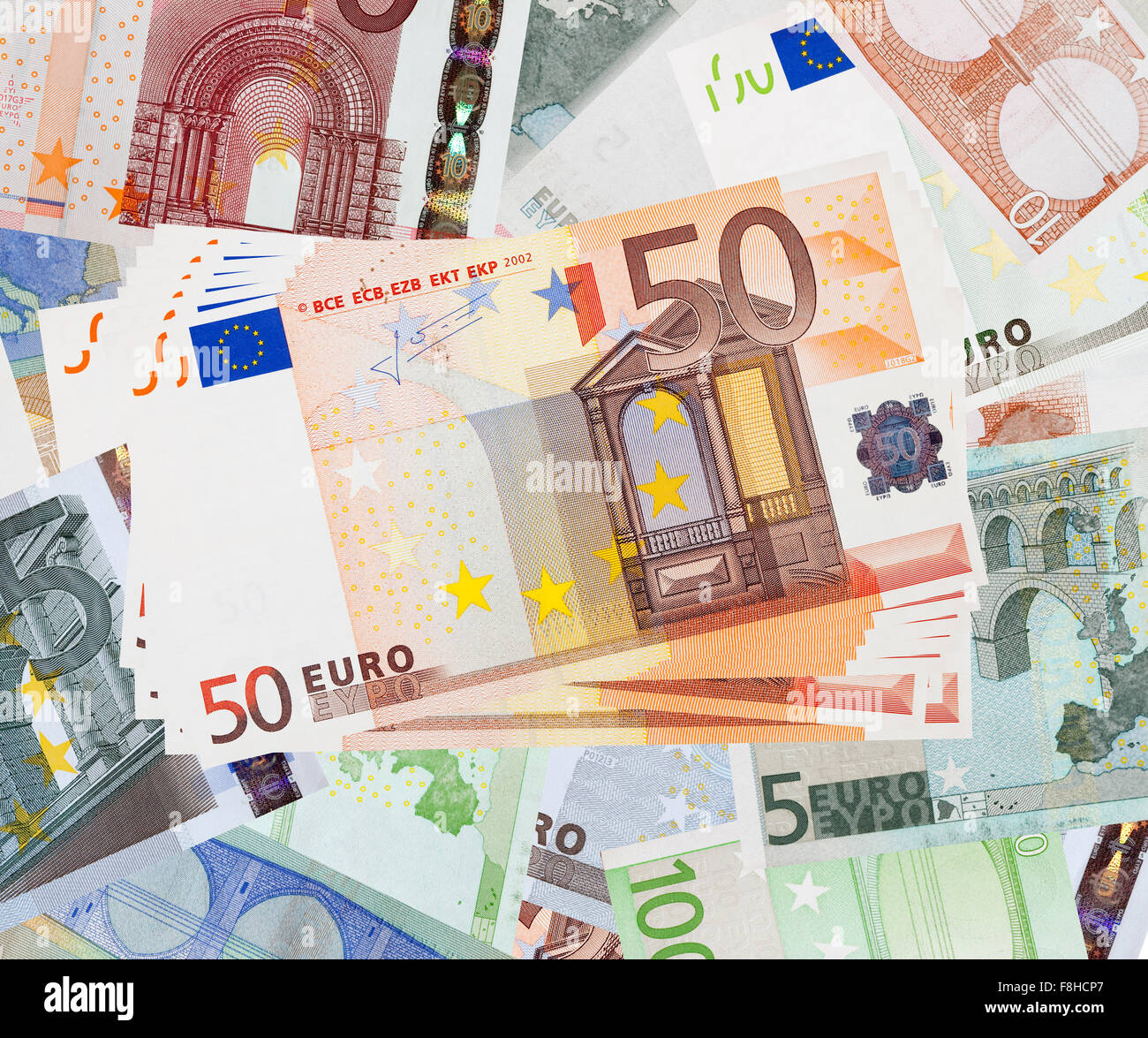 50 euro banknotes over background of many euro banknotes Stock Photo ...