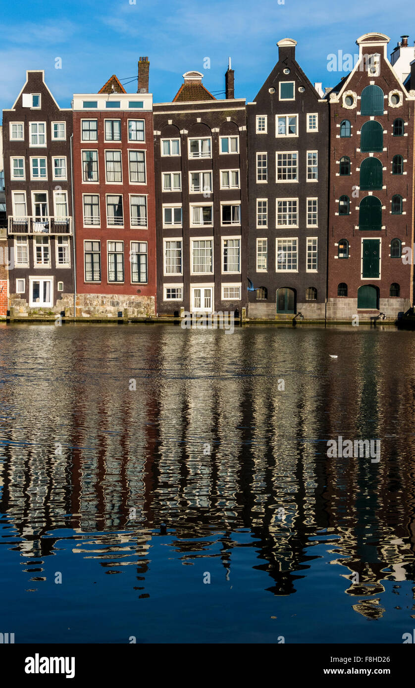 Traditional dutch buildings on a canal in Amsterdam Holland Stock Photo ...