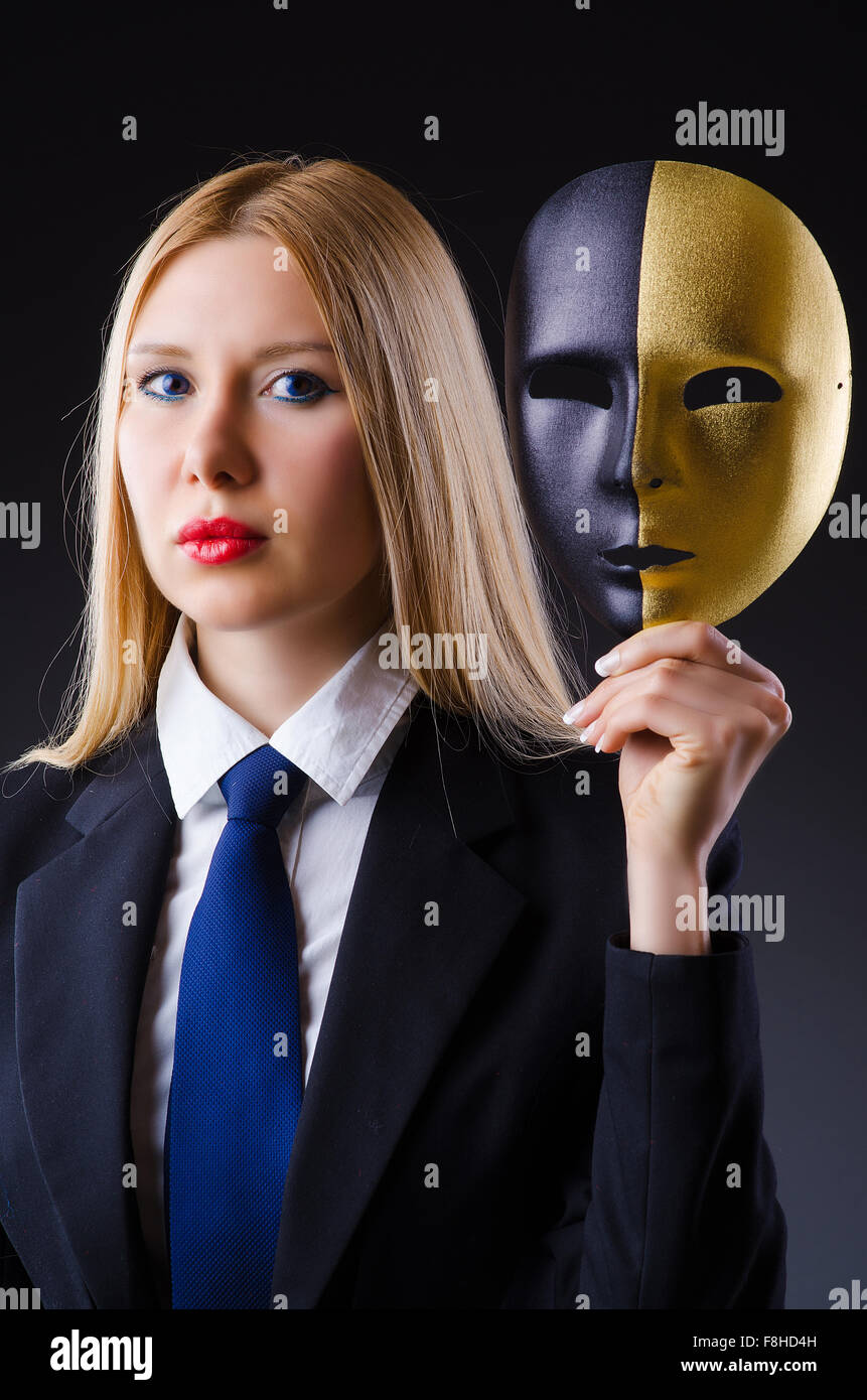 Woman with mask in hypocrisy concept Stock Photo - Alamy